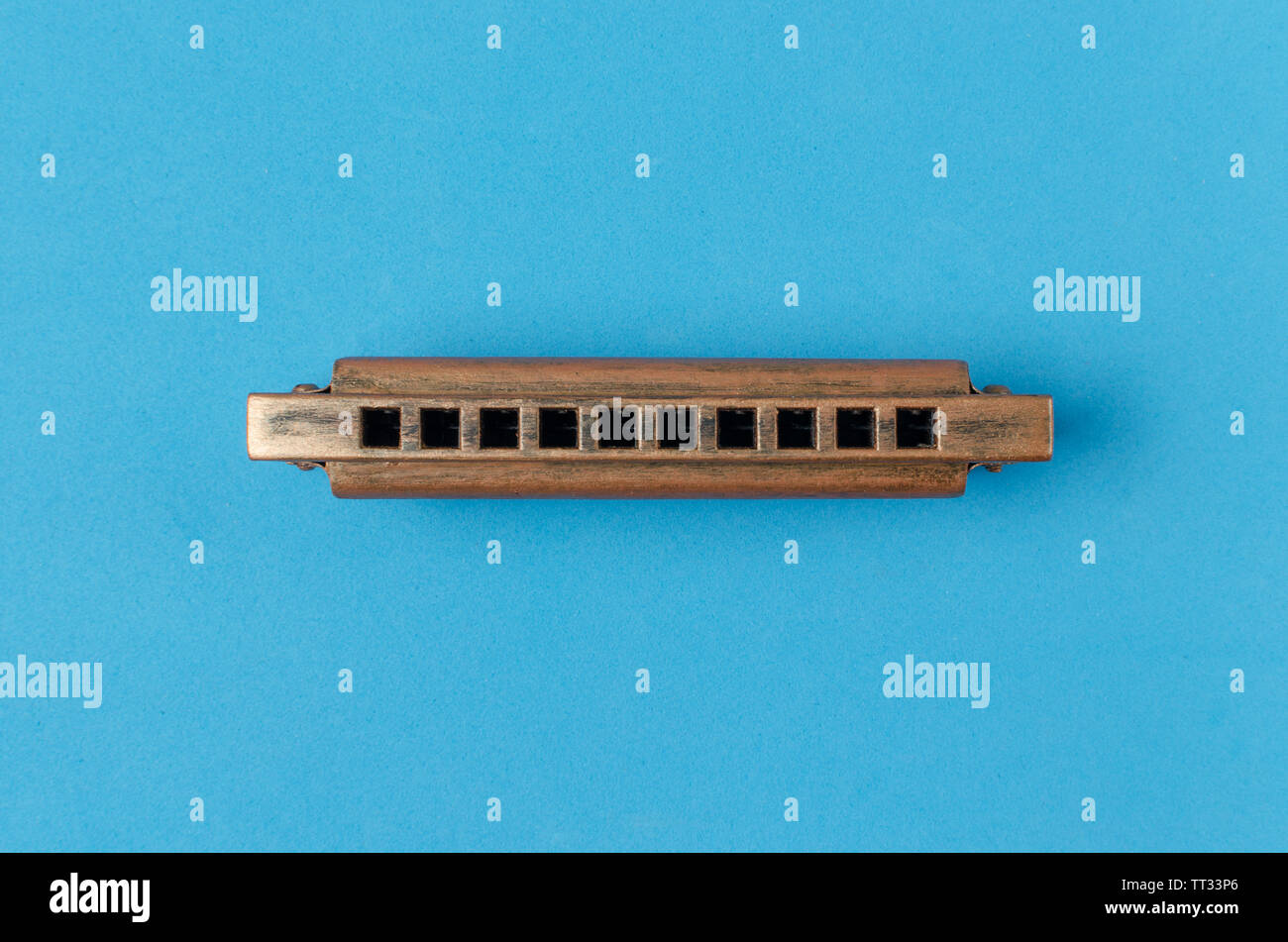 Old harmonica on a blue background.Musical instrument Stock Photo - Alamy
