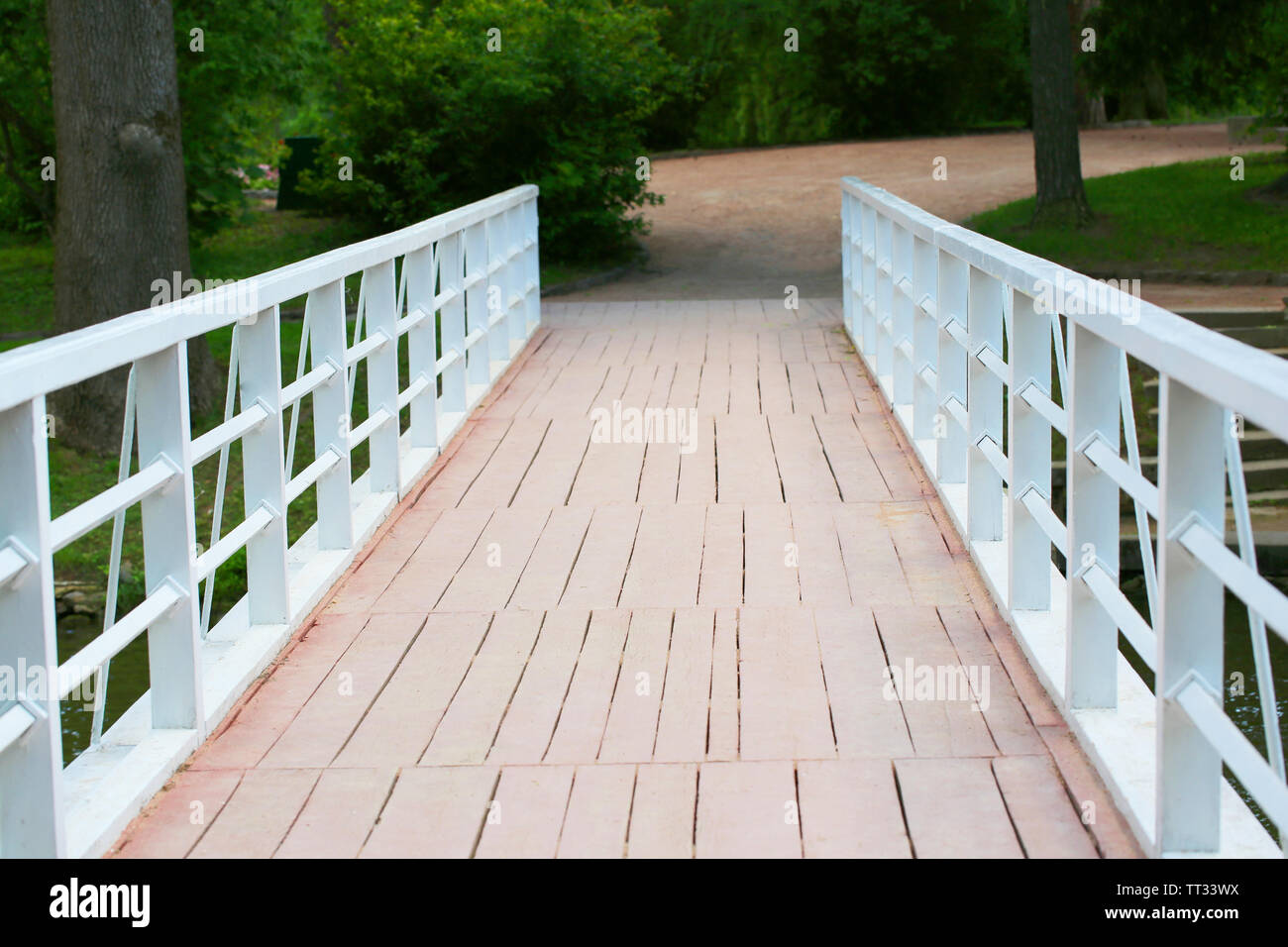Small bridge in green park Stock Photo - Alamy