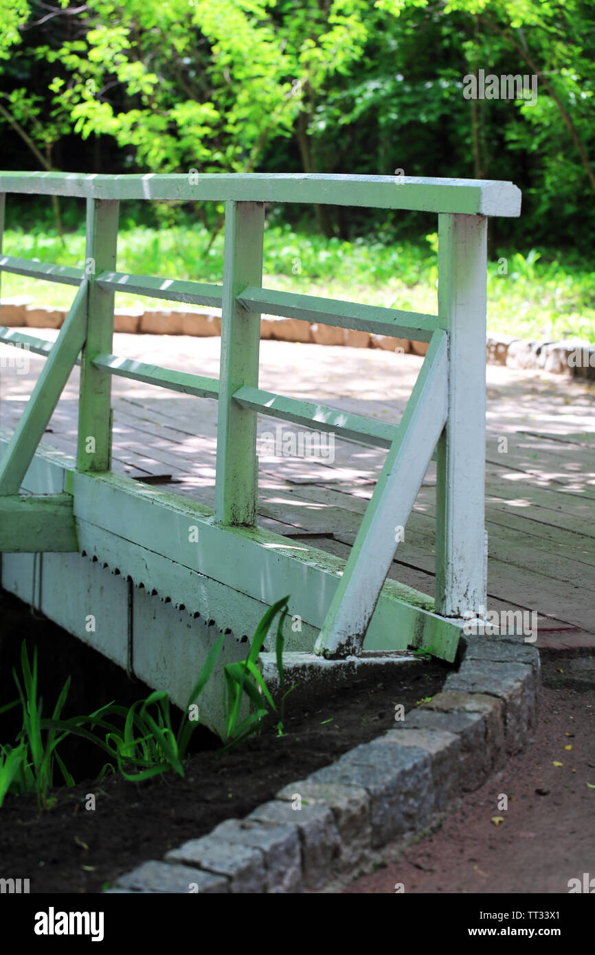 Small bridge in green park Stock Photo - Alamy