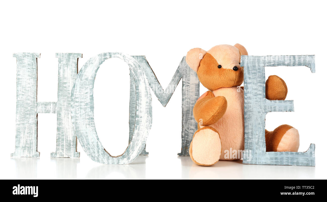 Decorative letters forming word HOME with teddy bear isolated on white ...