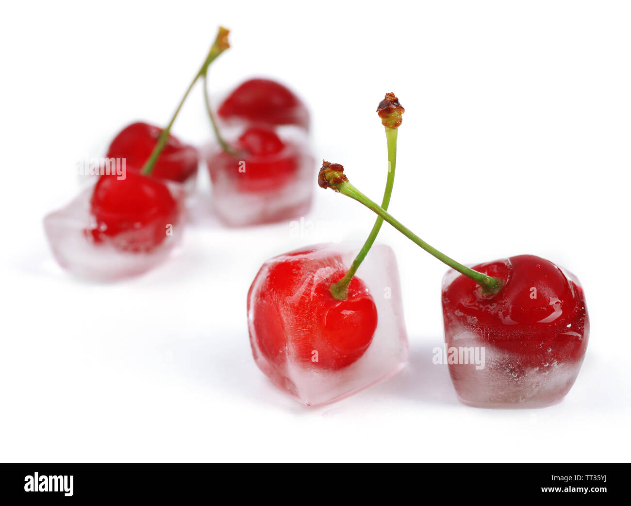 Cherry in ice cube isolated on white Stock Photo - Alamy