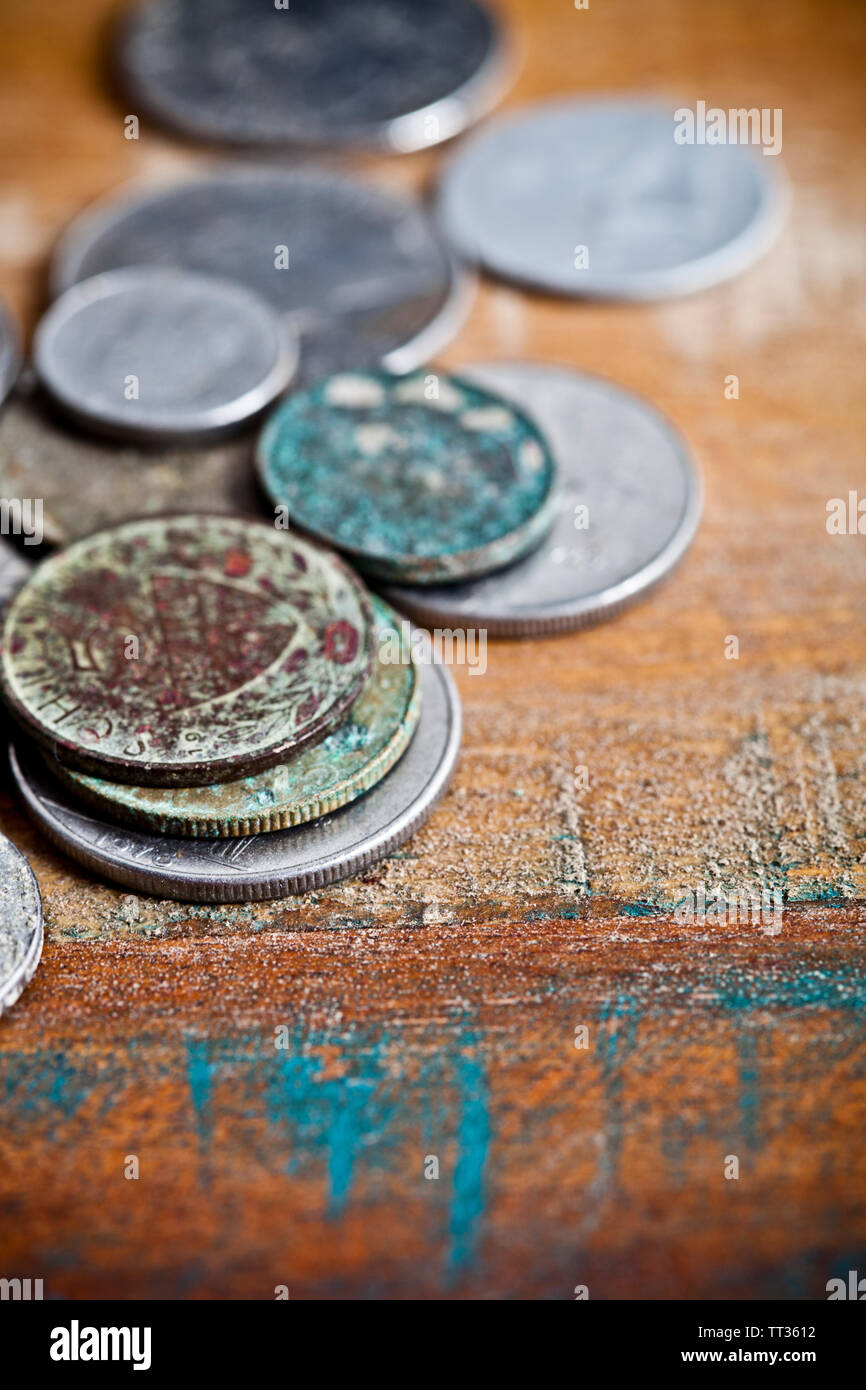 Pile of different ancient copper coins with patina closeup on rustic ...