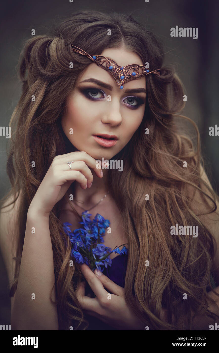 Portrait of a girl elf with long hair and blue eyes, wears a tiara with ...