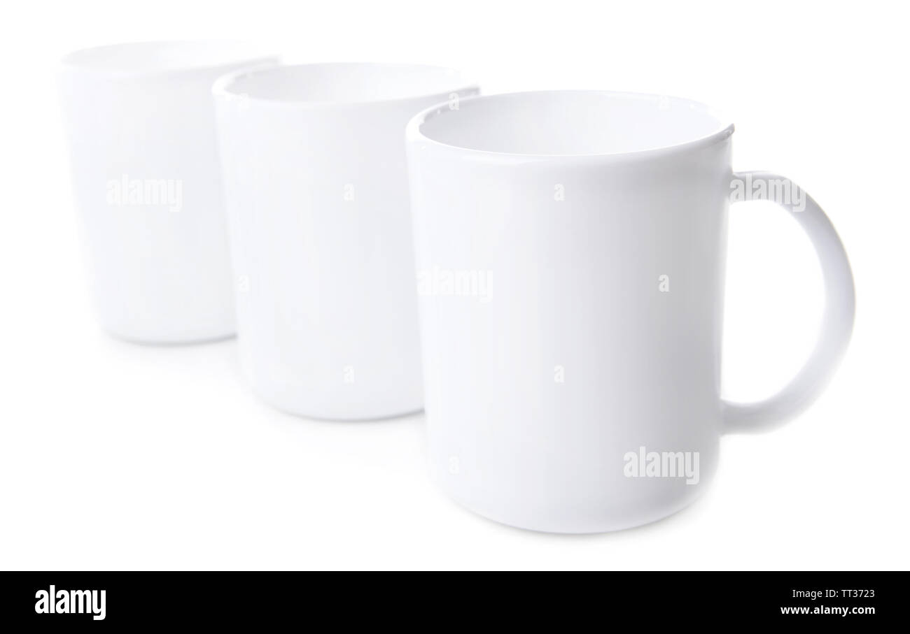 Set of white cups isolated on white Stock Photo - Alamy