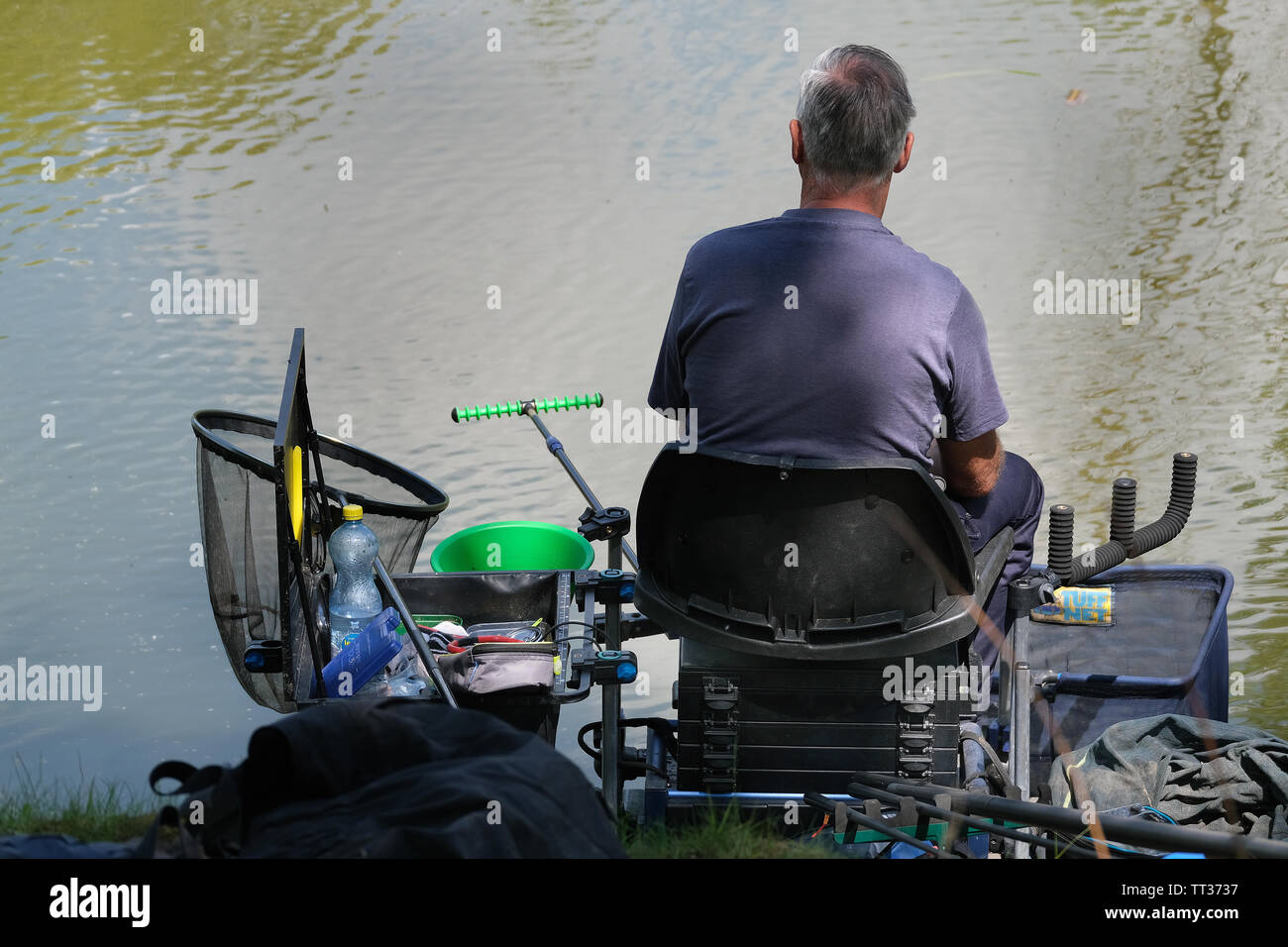 Match angler concentrating on catching fish in competition Stock Photo ...