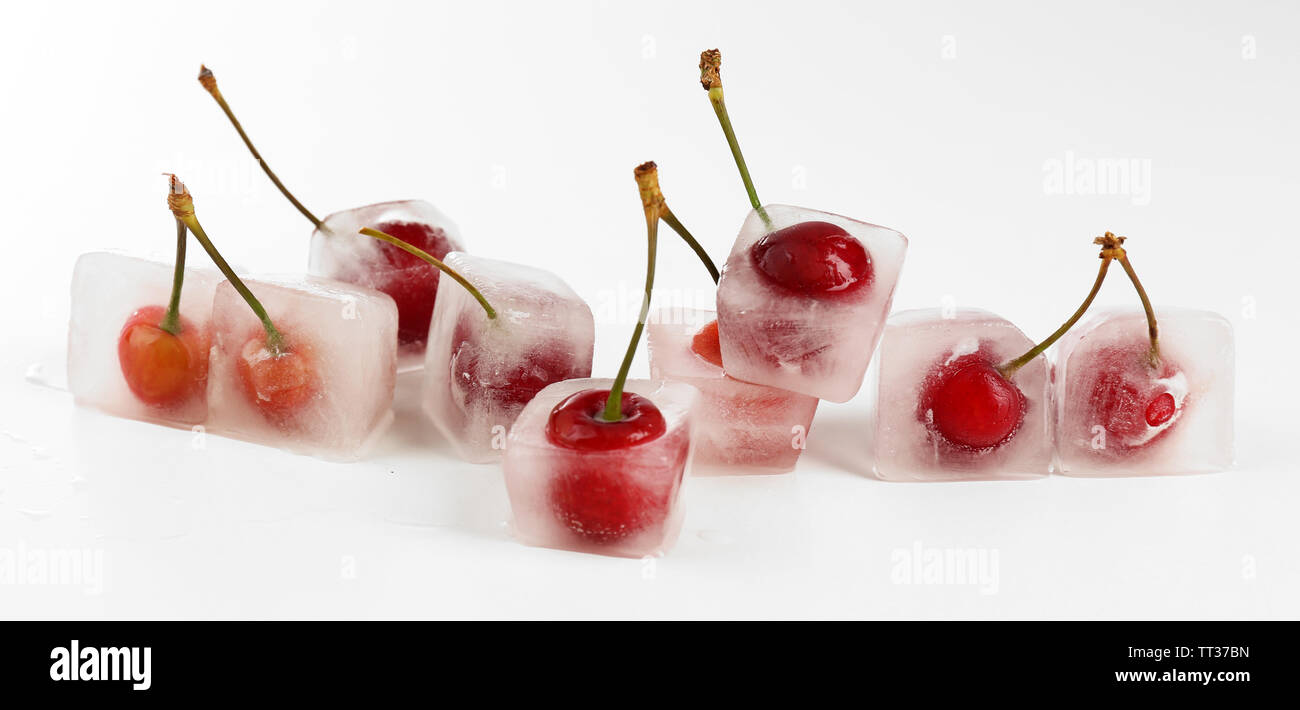 Cherry in ice cube isolated on white Stock Photo - Alamy
