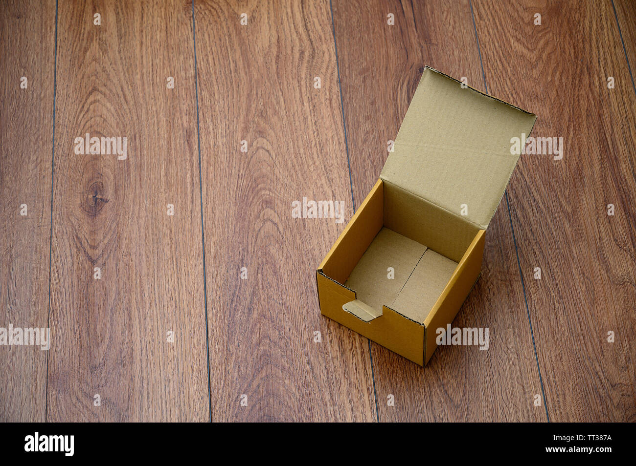 box empty open cardboard box on wooden surface with empty space top ...