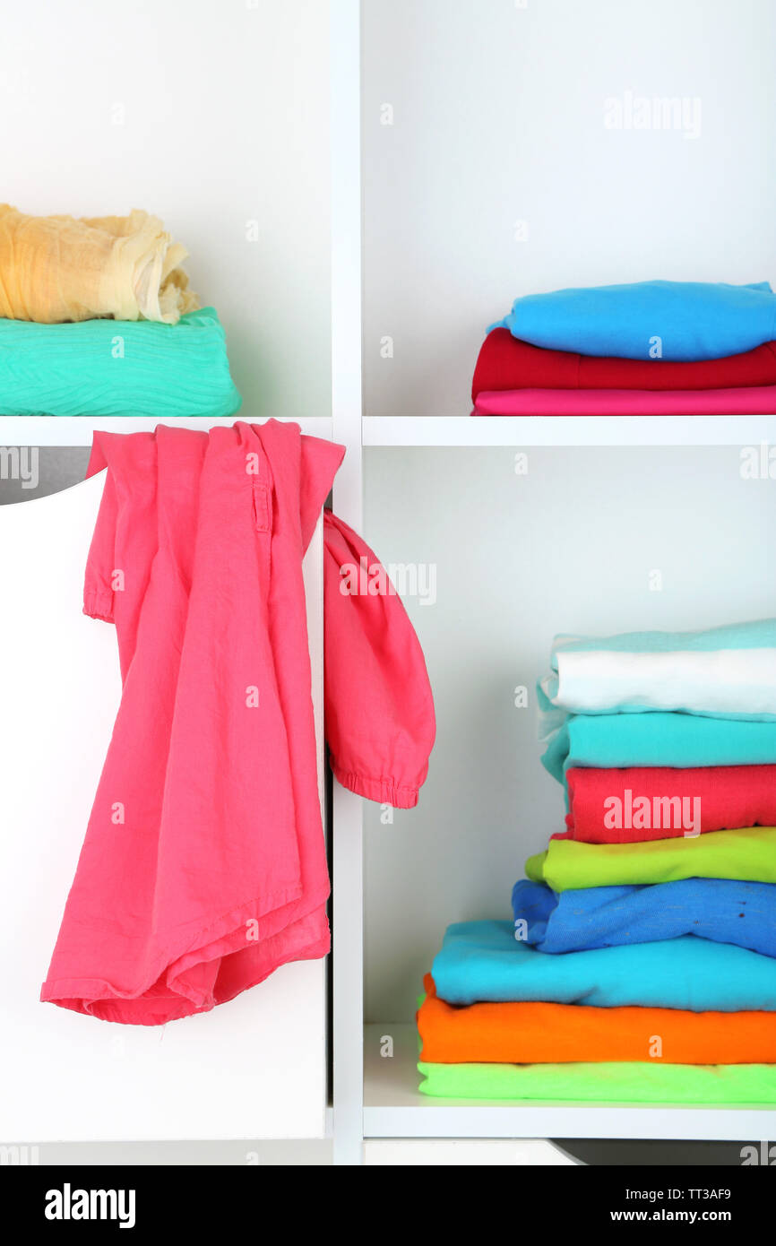 Clothes on shelves close-up Stock Photo - Alamy