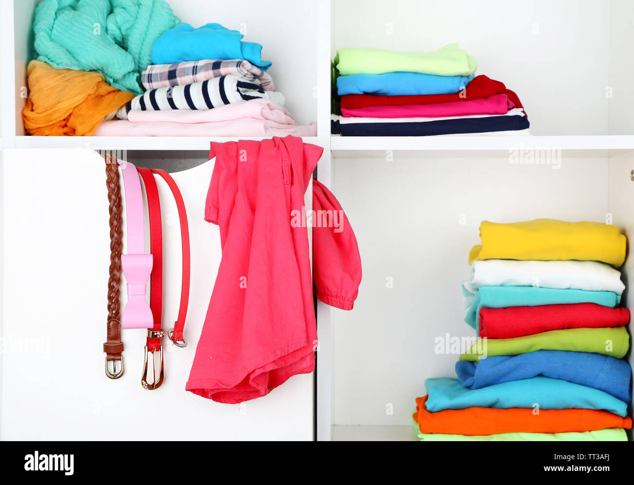 Clothes on shelves close-up Stock Photo - Alamy