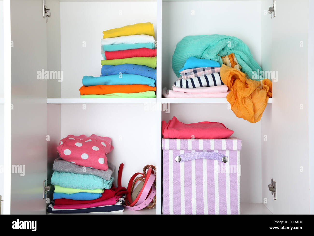 Clothes on shelves close-up Stock Photo - Alamy