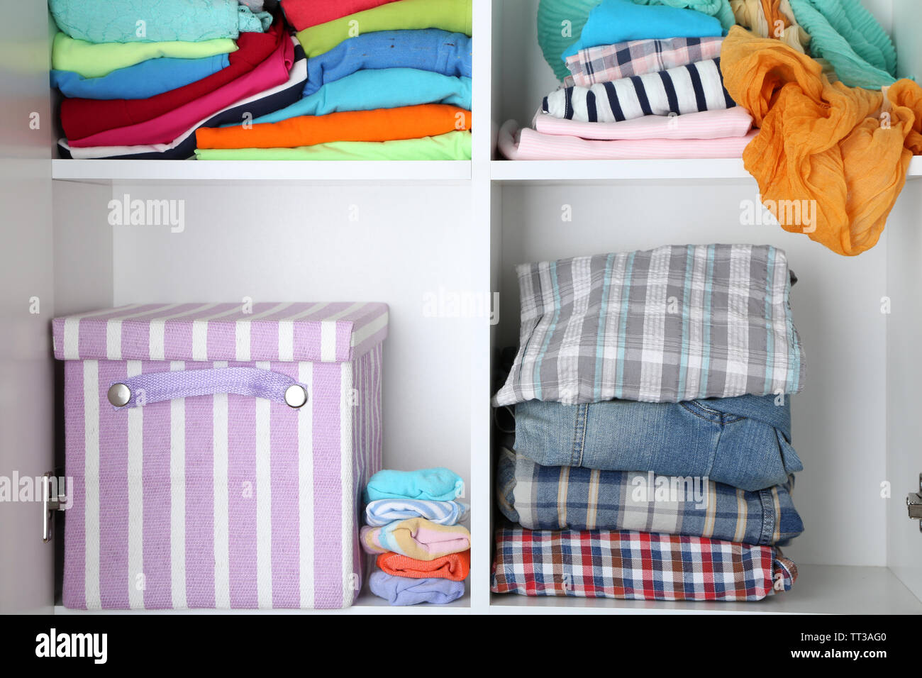 Clothes on shelves close-up Stock Photo - Alamy
