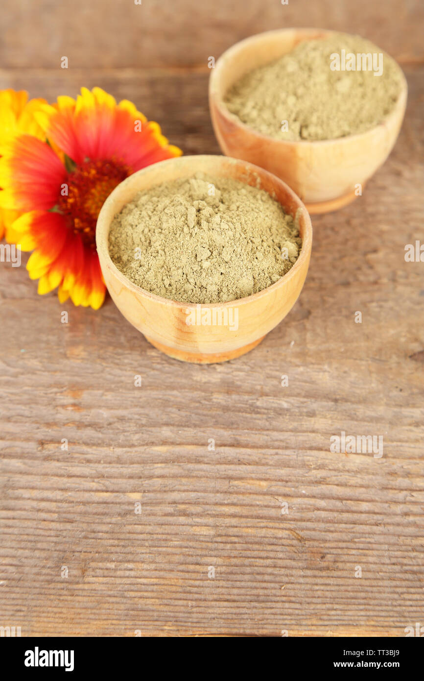 Dry henna powder in bowls on wooden table Stock Photo - Alamy