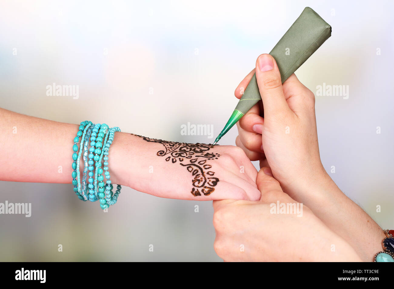 Process of applying Mehndi on female hand, close up Stock Photo - Alamy