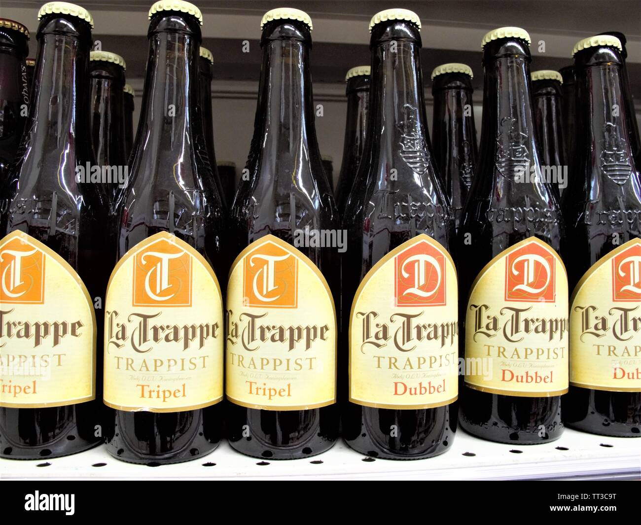 Bottles of Trappe beers at the AUUCHAN SUPERMARKET IN rOME Stock Photo ...