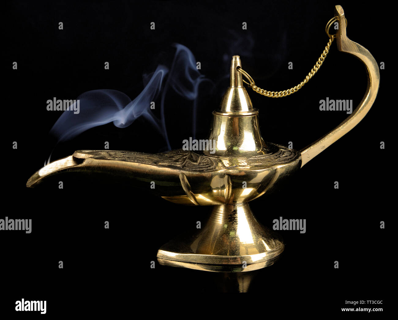 Magic lamp isolated on black Stock Photo - Alamy
