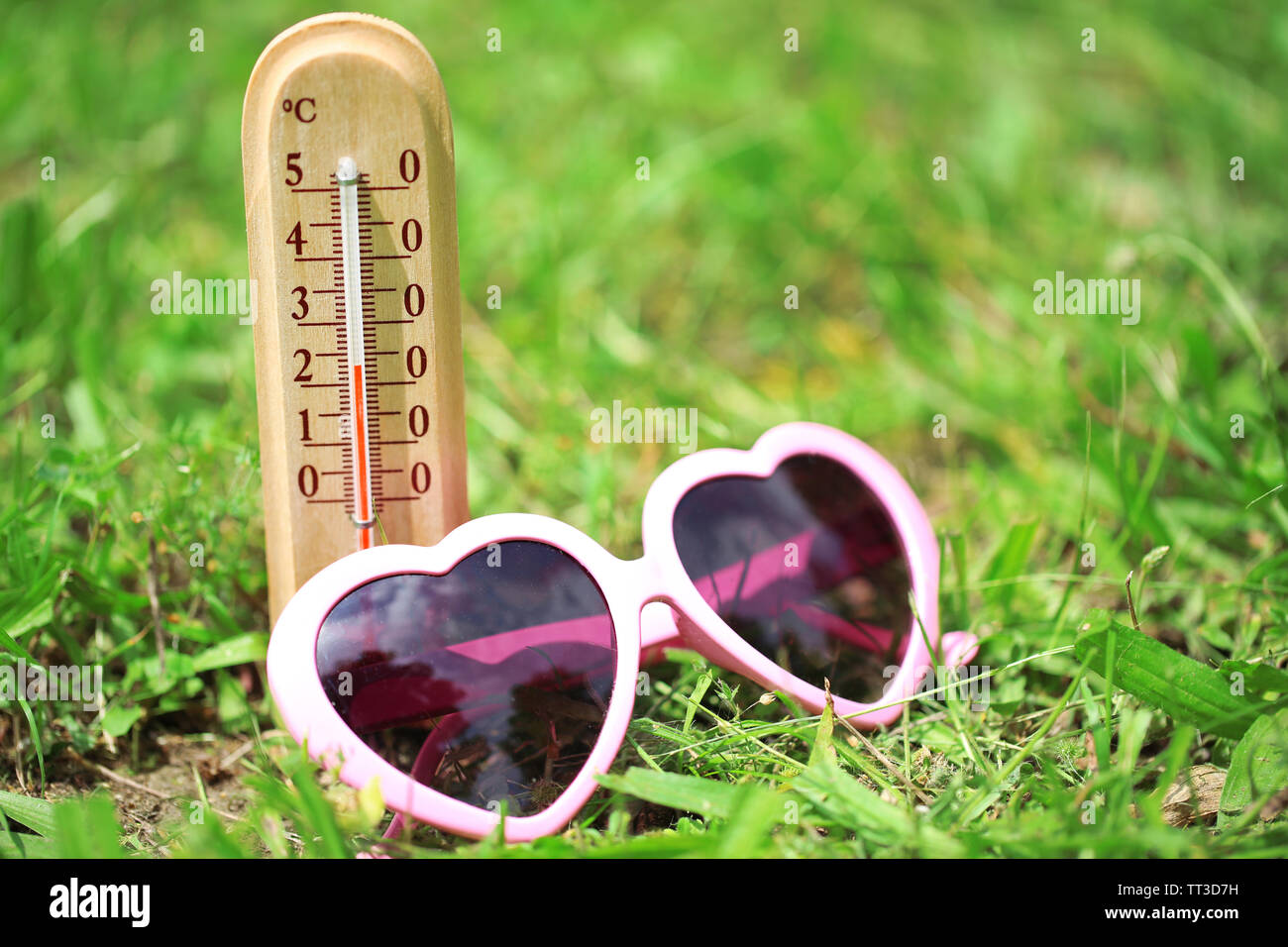 Thermometer on grass close-up Stock Photo - Alamy