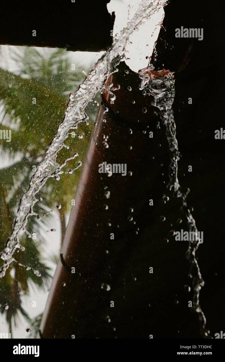Water dripping from roof top on a rainy day Stock Photo - Alamy