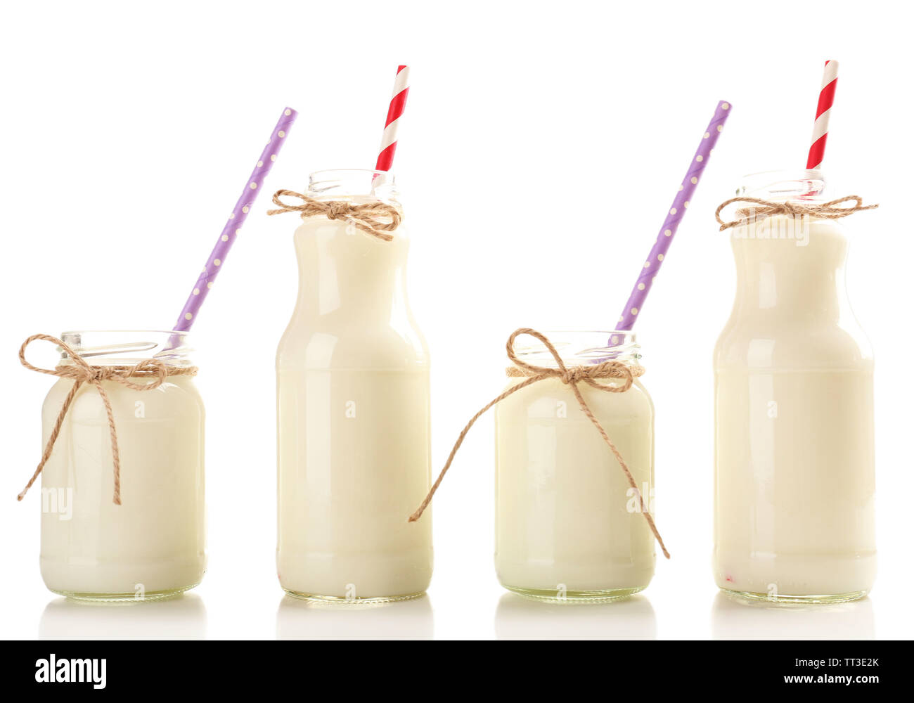 Bottles of milk isolated on white Stock Photo - Alamy