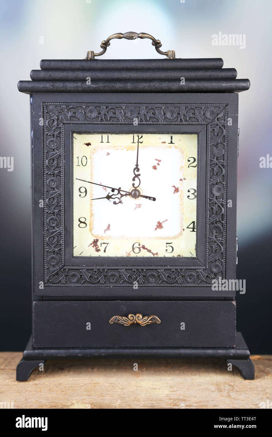 Old retro clock on abstract background Stock Photo - Alamy