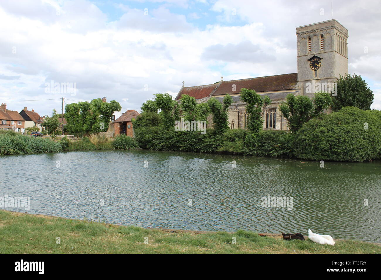 Church and pond Stock Photo - Alamy