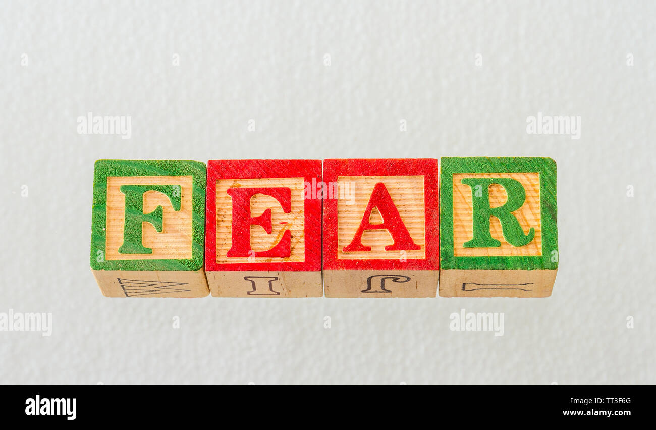 The term fear visually displayed on a clear background using colorful ...