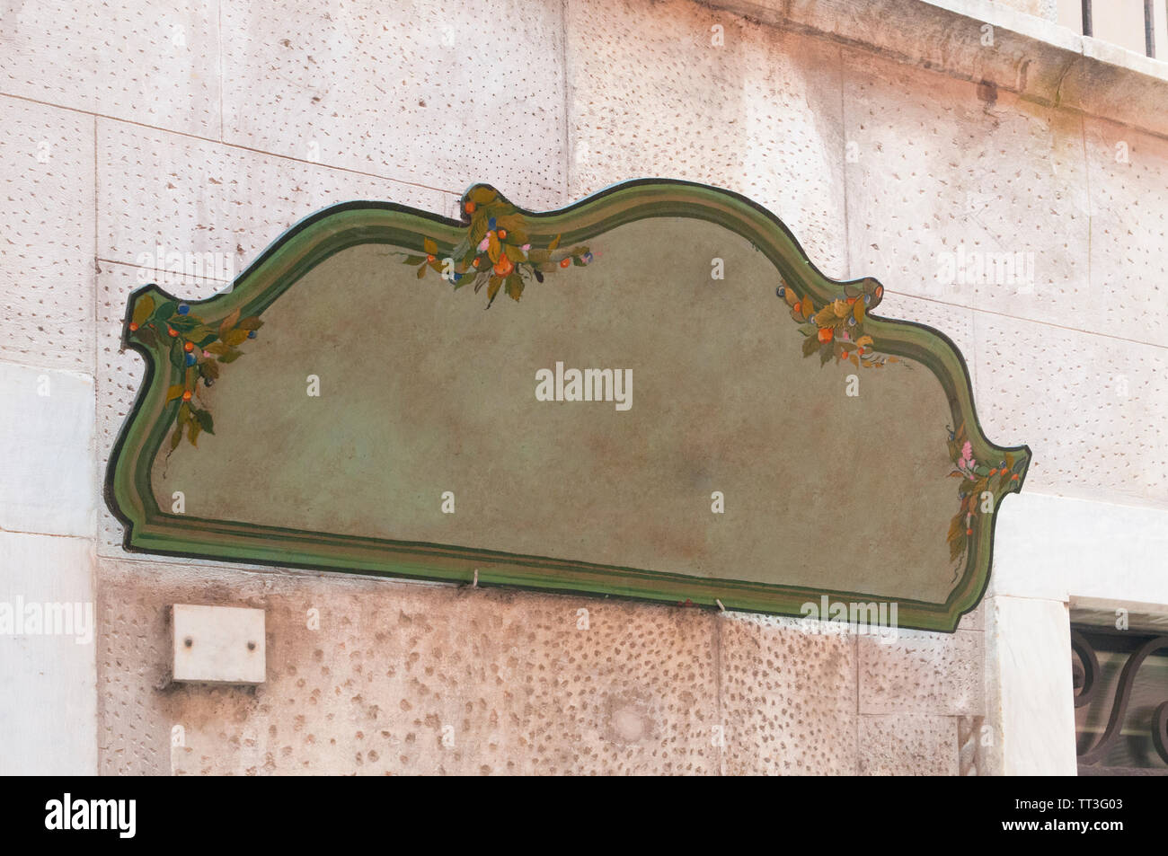 Antique blank decorated wood store sign hanging on a marble wall Stock ...