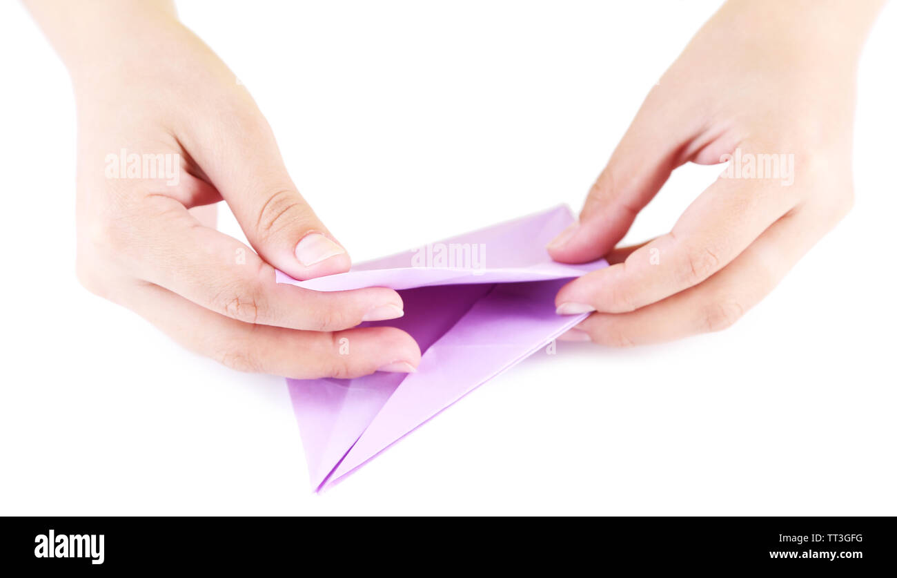Hands making origami toy, close up, isolated on white Stock Photo - Alamy