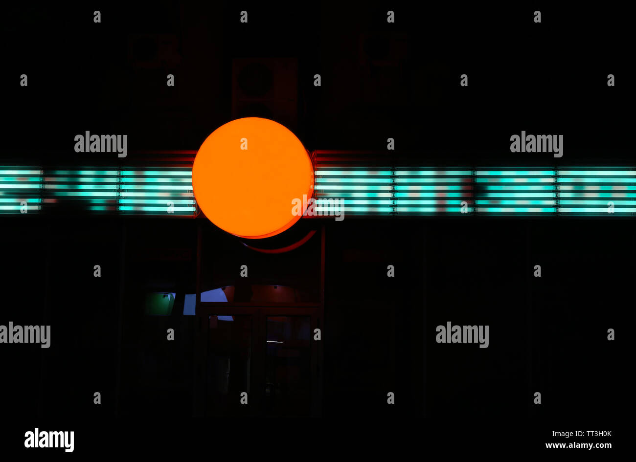 Neon sign on store at night Stock Photo - Alamy