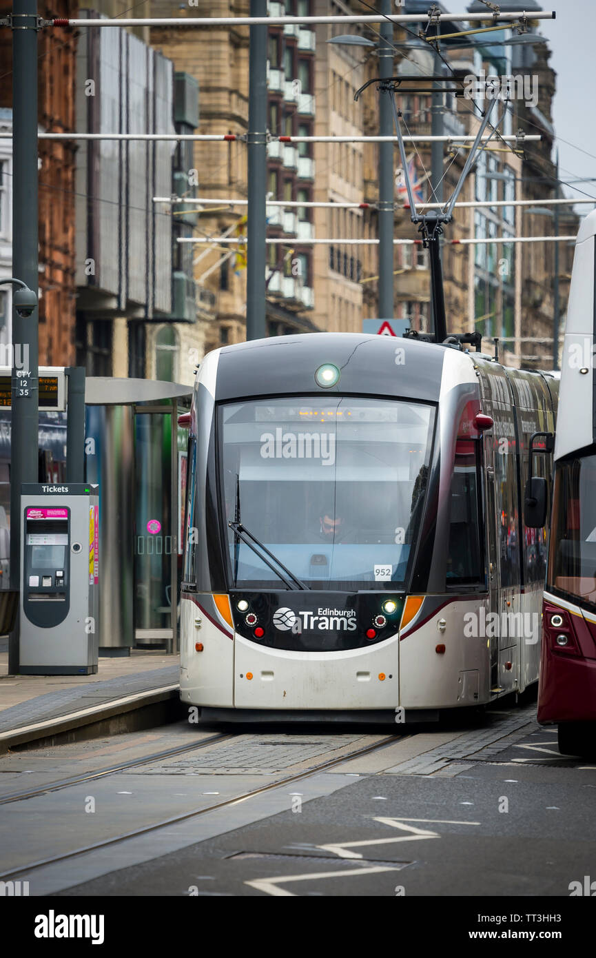 Tram waiting at a stop in the centre of the City of Edinburgh, Scotland ...