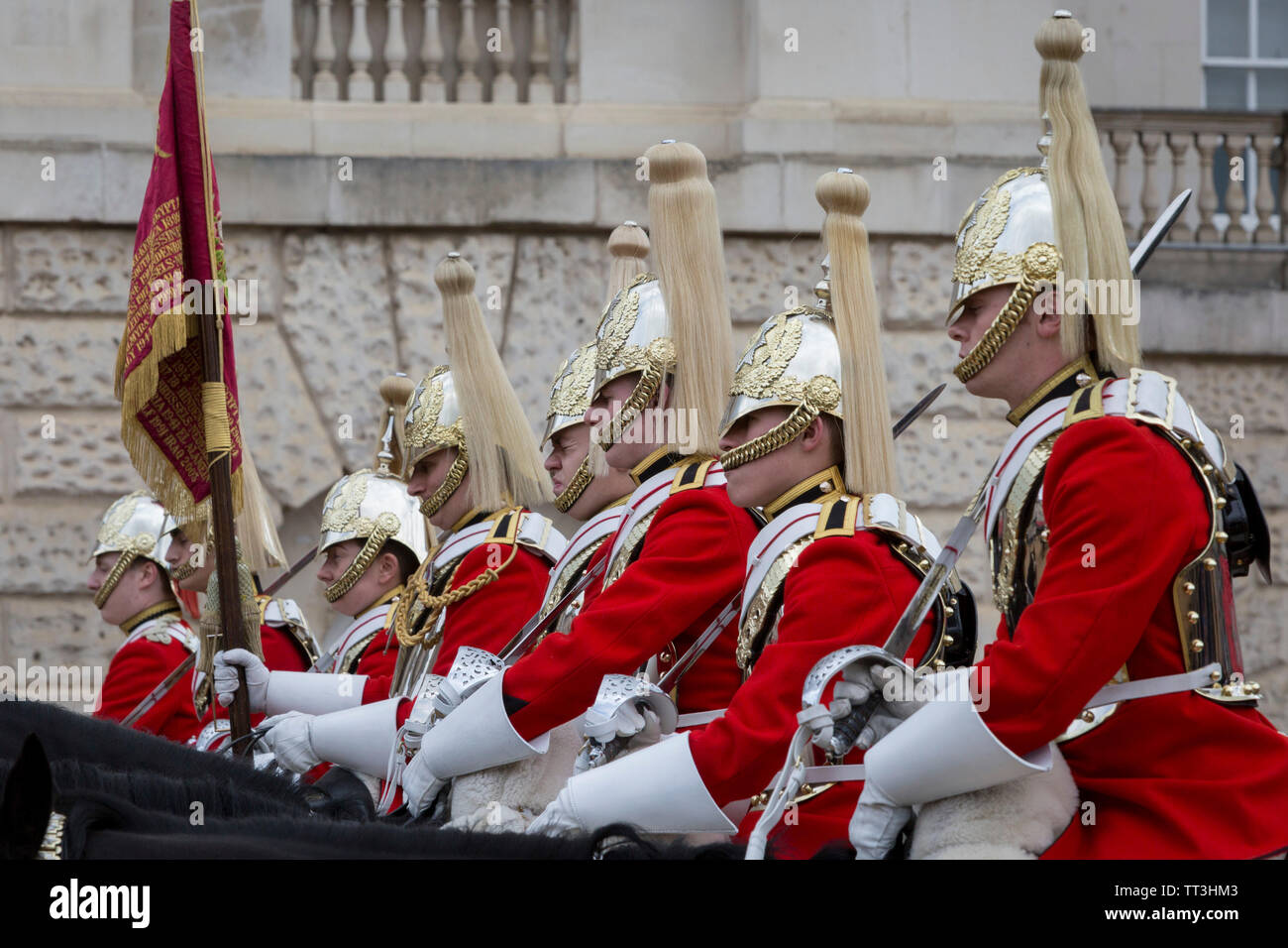 Members of the The Queen's Life Guard (red tunics) and the Blues and ...