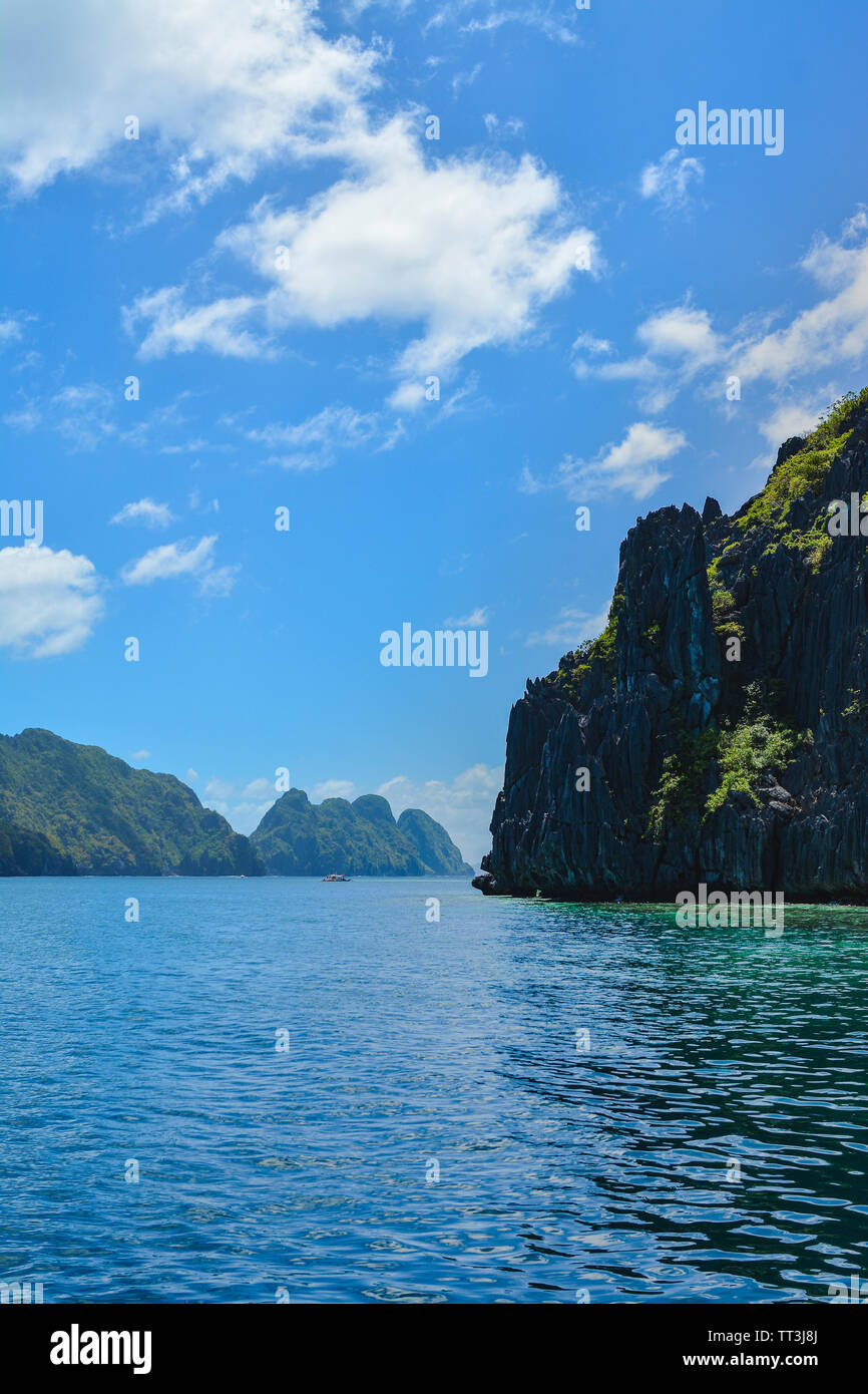Nature landscape view of the sea and mountains. Blue sky and clouds ...