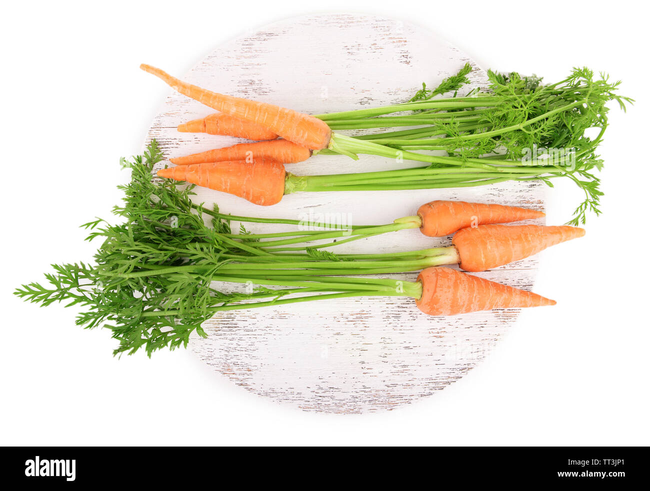Fresh carrot on wooden stand isolated on white Stock Photo - Alamy