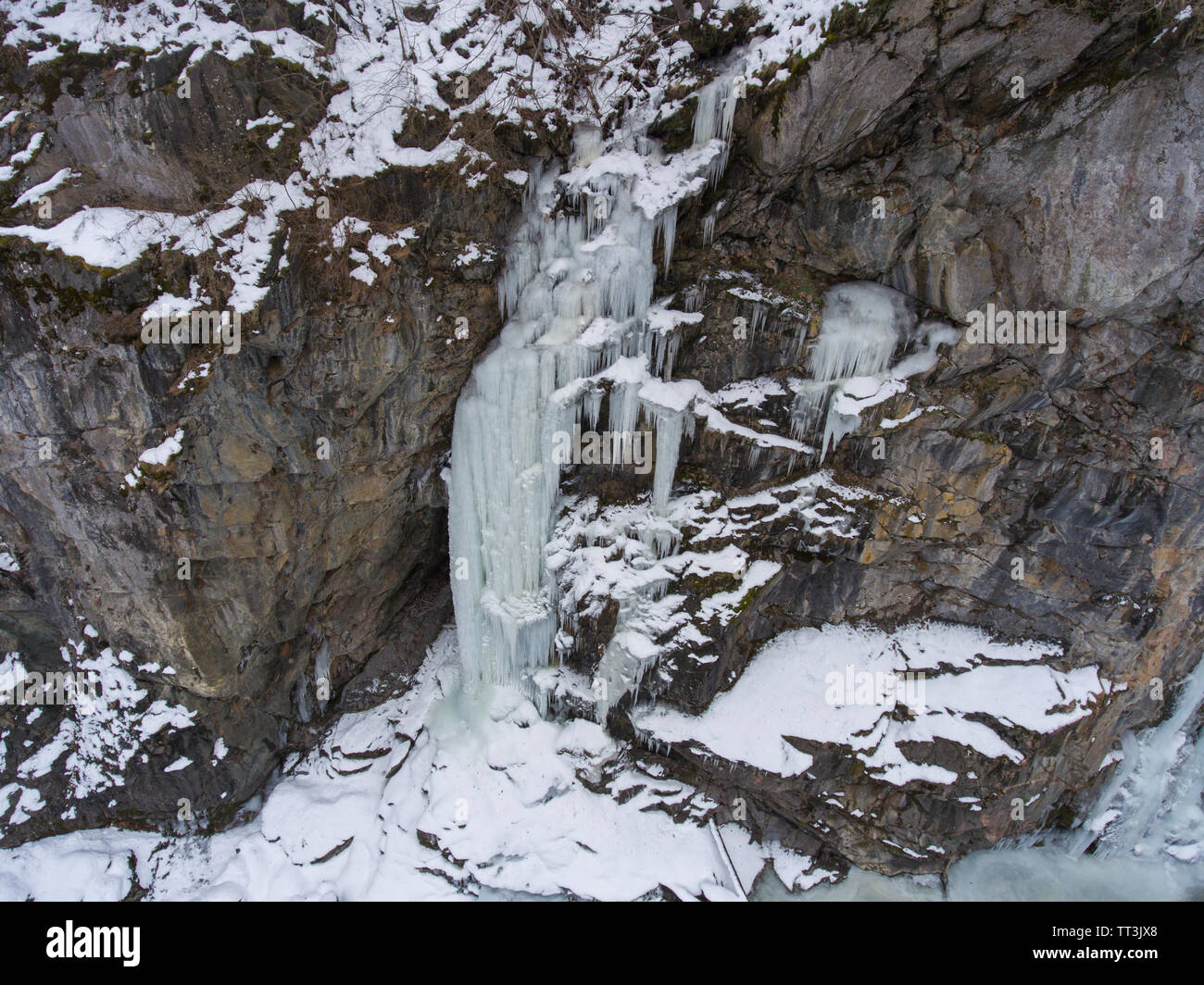 Aerial Photos. Large icicles hanging from the cliff Stock Photo - Alamy