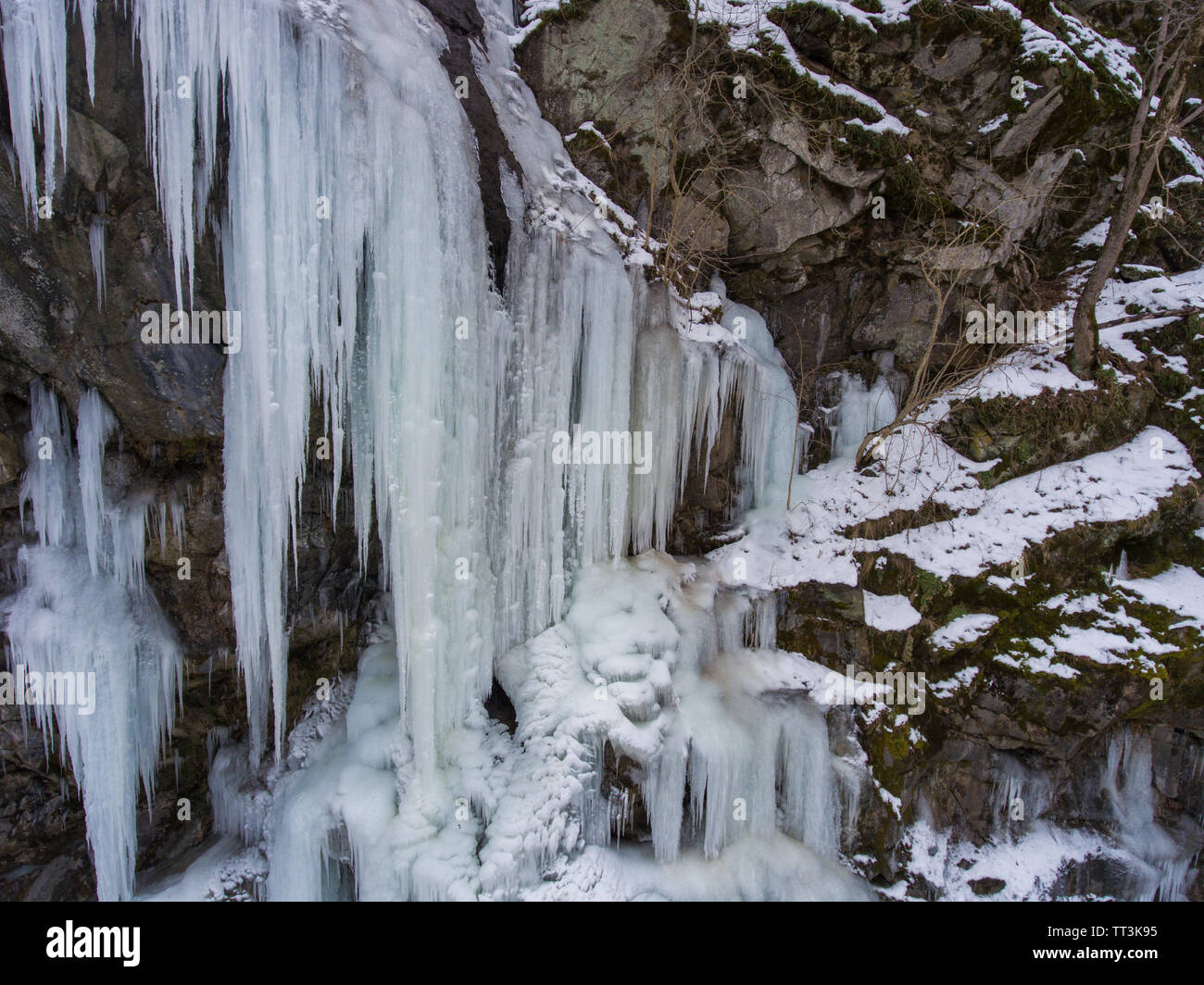 Aerial Photos. Large icicles hanging from the cliff Stock Photo - Alamy