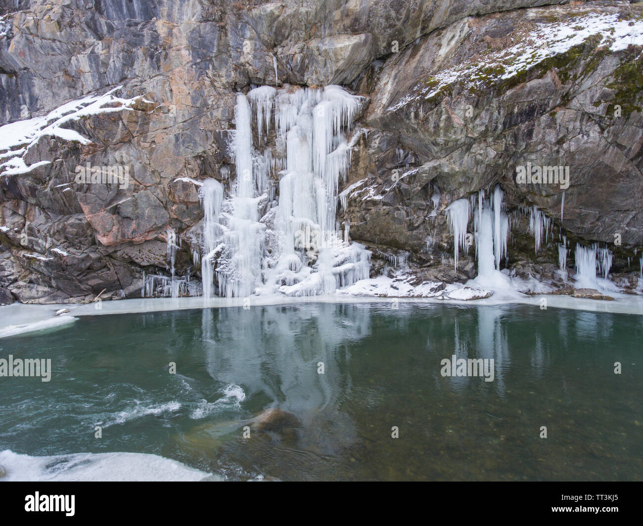 Aerial landscape frozen waterfall over the lake Stock Photo - Alamy
