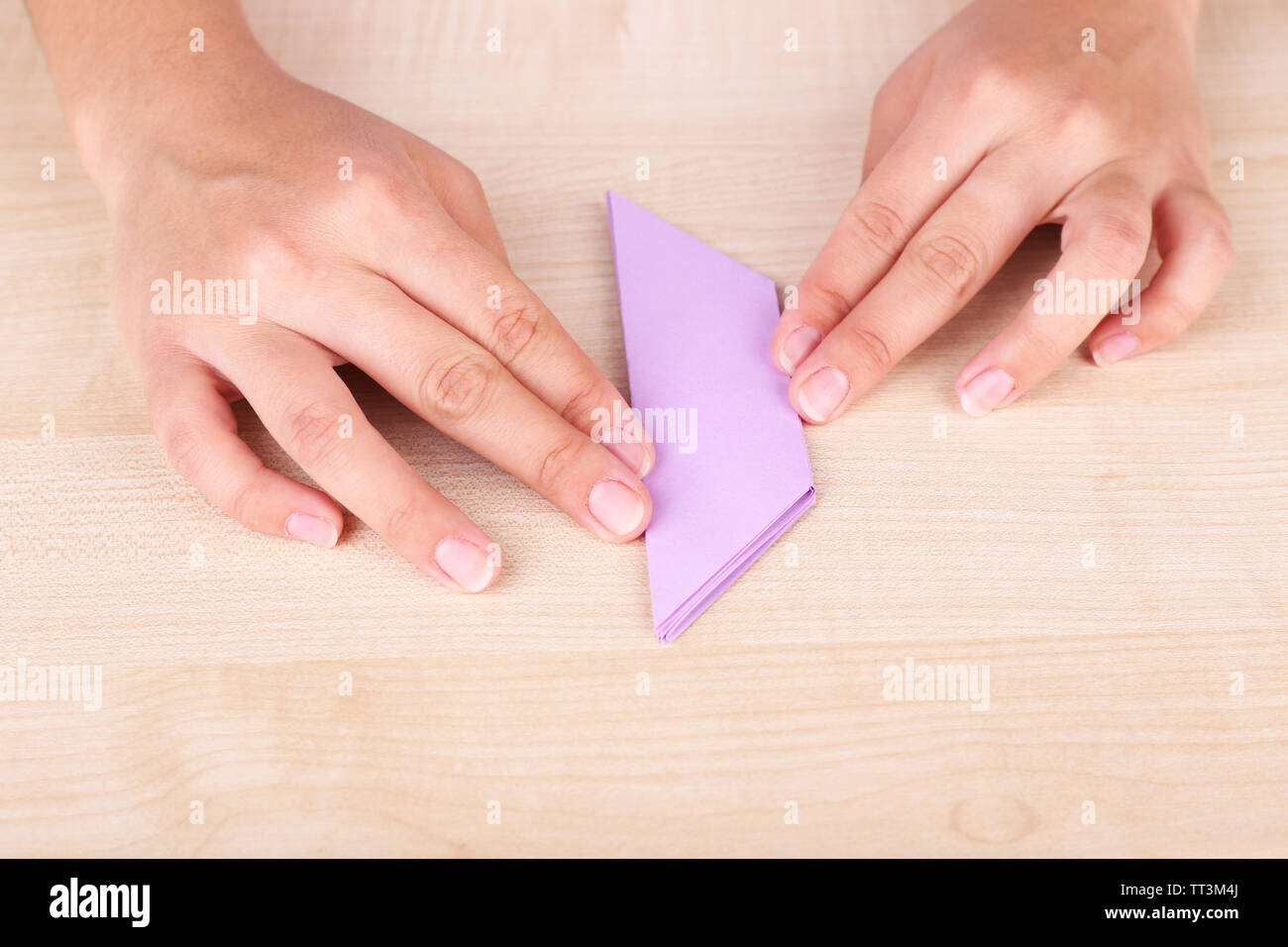 Hands making origami figure, close up Stock Photo - Alamy