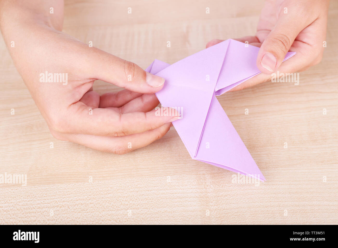 Hands making origami figure, close up Stock Photo - Alamy