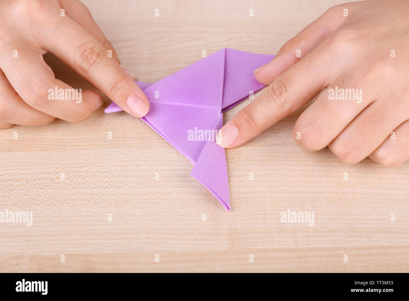 Hands making origami figure, close up Stock Photo - Alamy