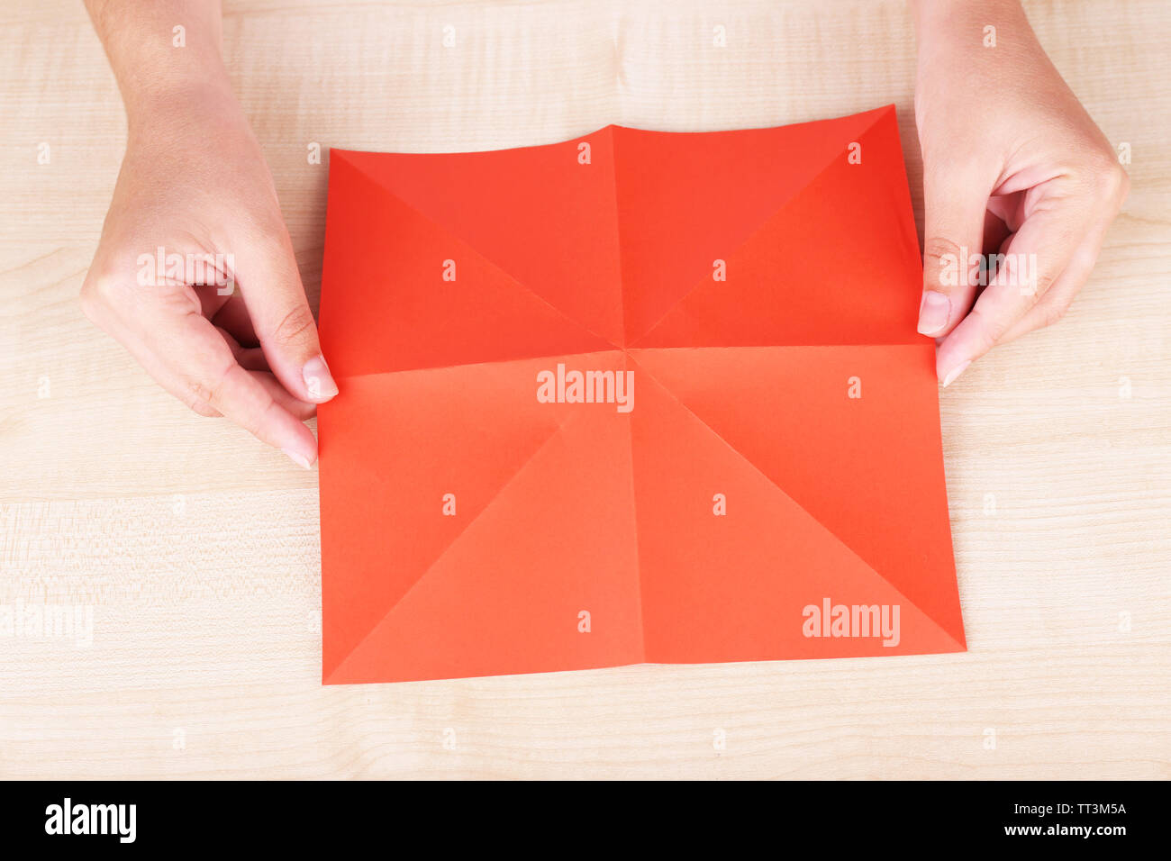 Hands making origami figure, close up Stock Photo - Alamy