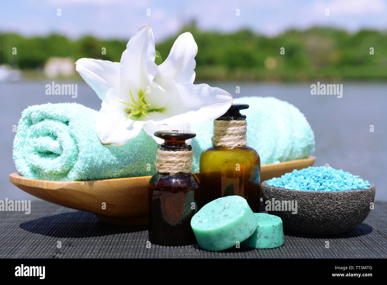 Herbal remedies for massage on bamboo mat, outdoor Stock Photo - Alamy