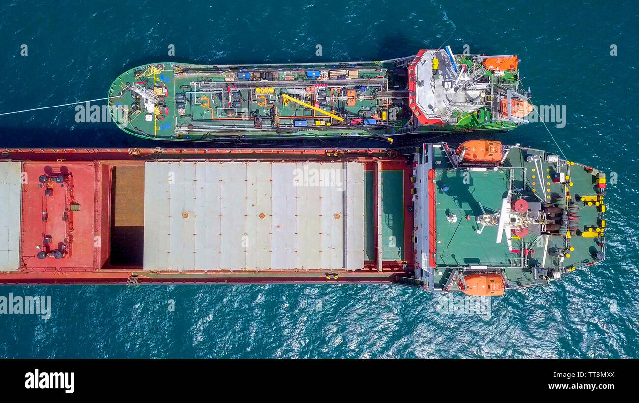 Refuelling at sea - Small Oil products ship fuelling a large Bulk ...