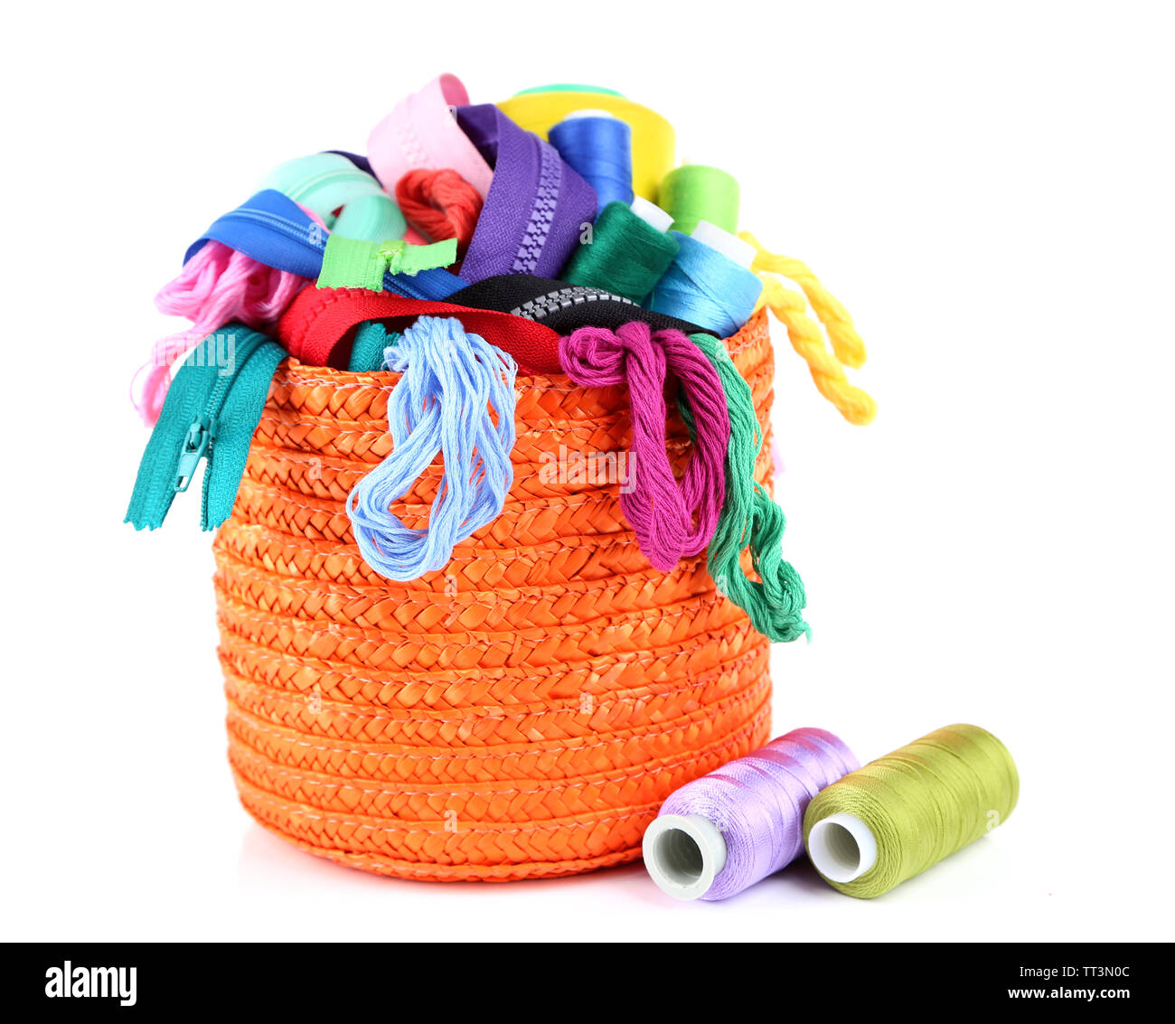 Round orange box full of multicoloured threads and everything necessary ...