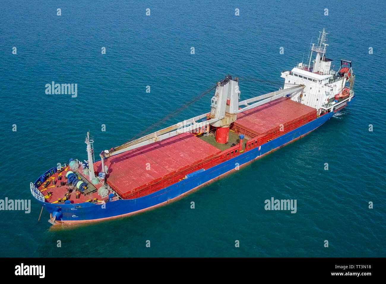 Red General cargo ship at sea - Aerial image Stock Photo - Alamy