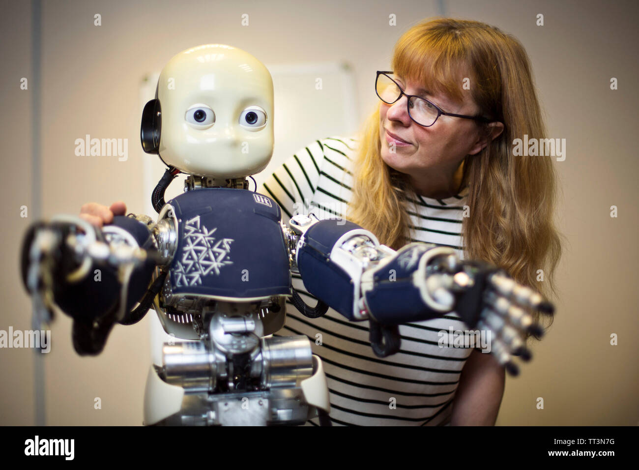 Professor Kerstin Dautenhahn interacting with intelligent robots ...