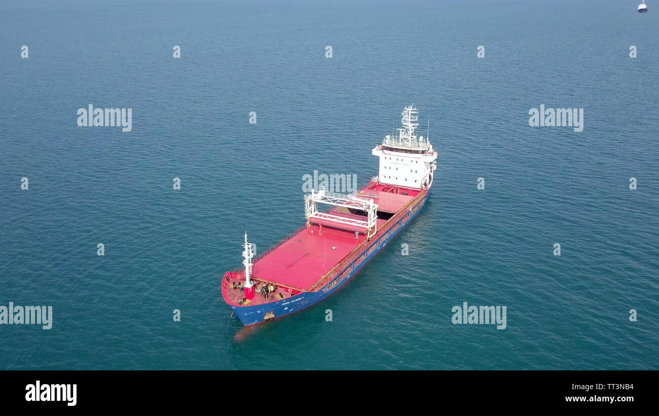 Red General cargo ship at sea - Aerial image Stock Photo - Alamy