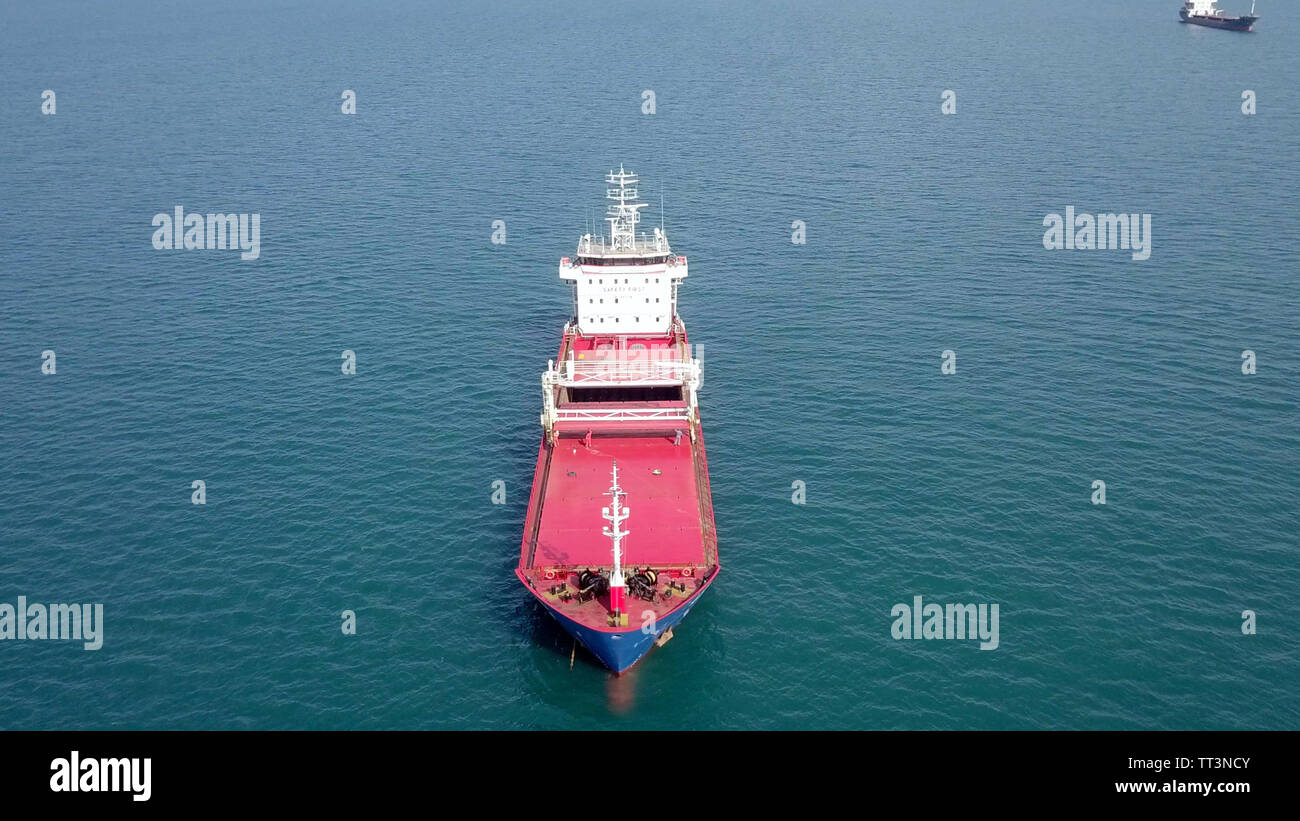 Red General cargo ship at sea - Aerial image Stock Photo - Alamy