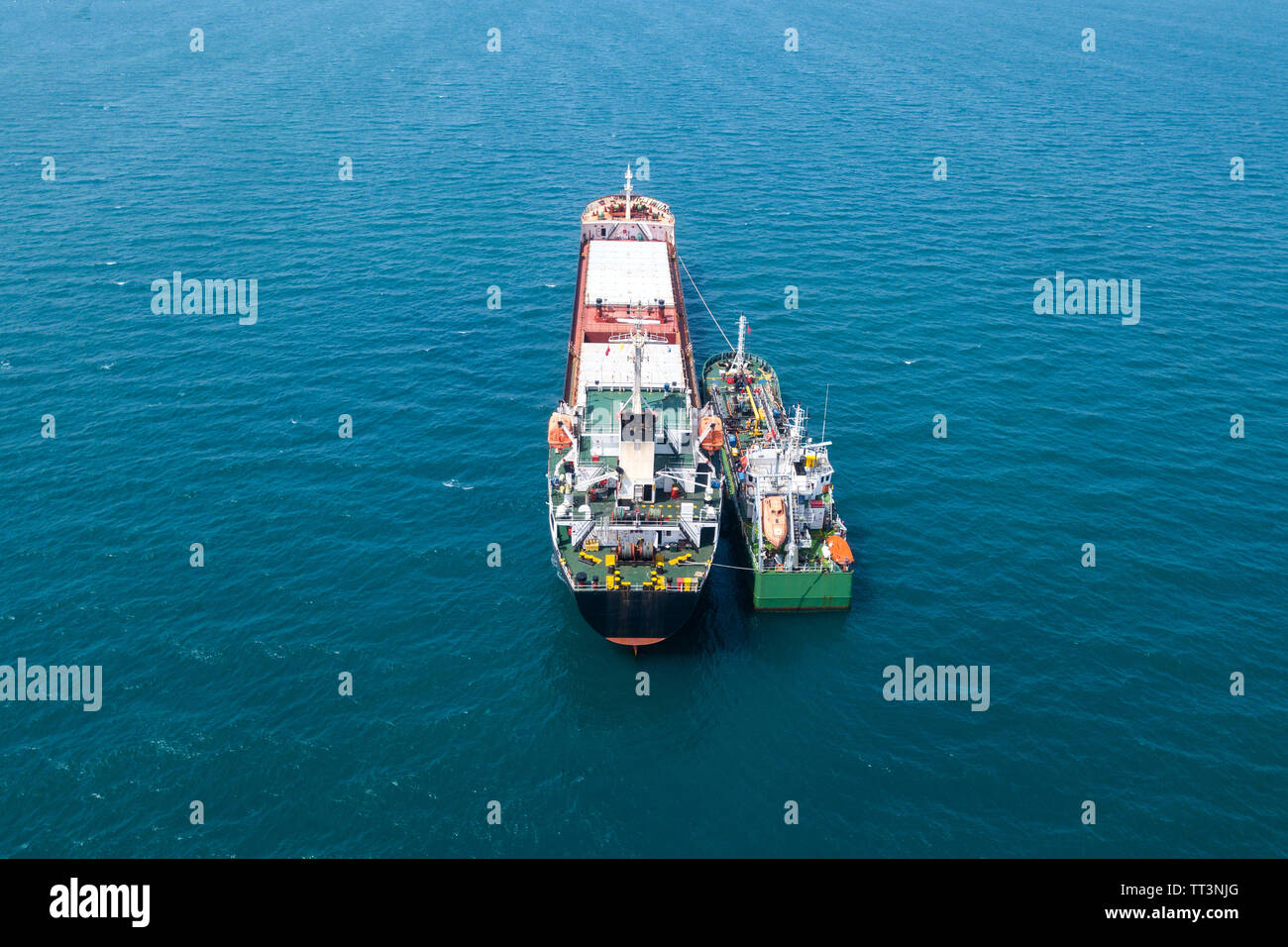 Refuelling at sea - Small Oil products ship fuelling a large Bulk ...
