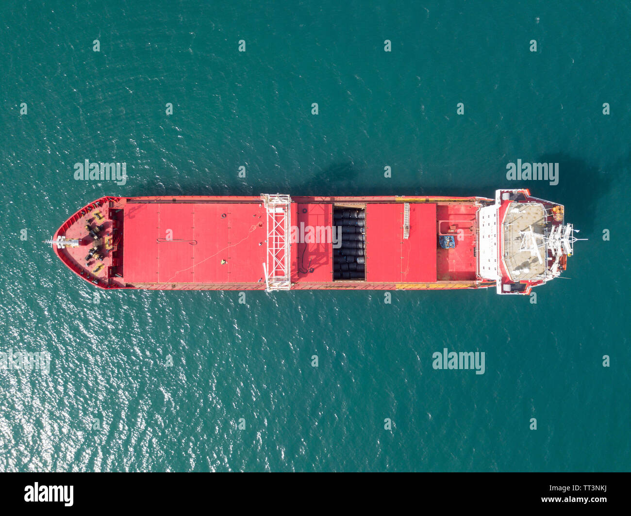 Red General cargo ship at sea - Aerial image Stock Photo - Alamy