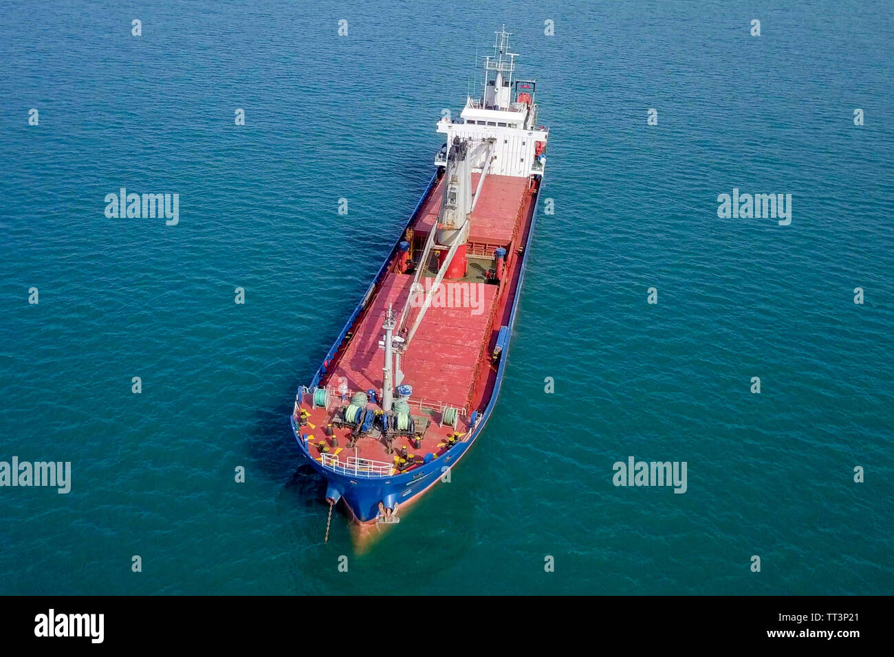 Red General cargo ship at sea - Aerial image Stock Photo - Alamy