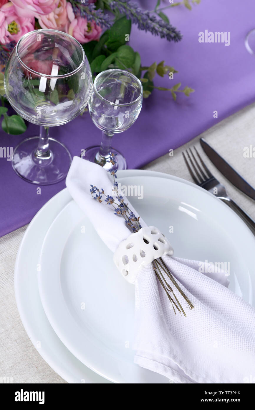 Dining table setting with lavender flowers on table, close-up. Lavender ...
